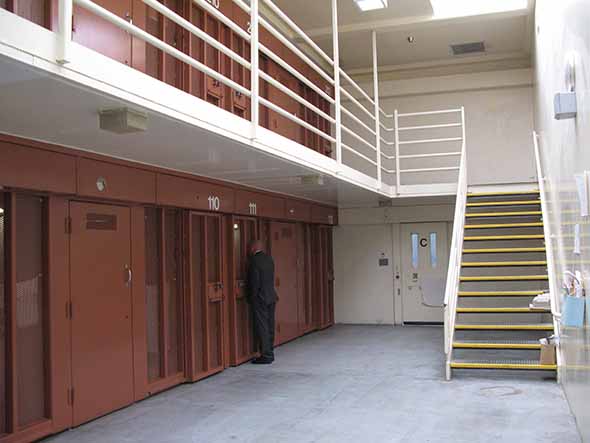 8-Officer-looking-into-one-Security-Housing-Unit-cell1 - Life of the Law